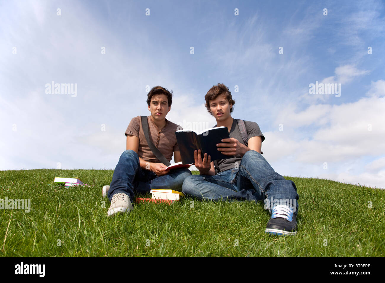 Two boys reading two books school hi-res stock photography and images ...