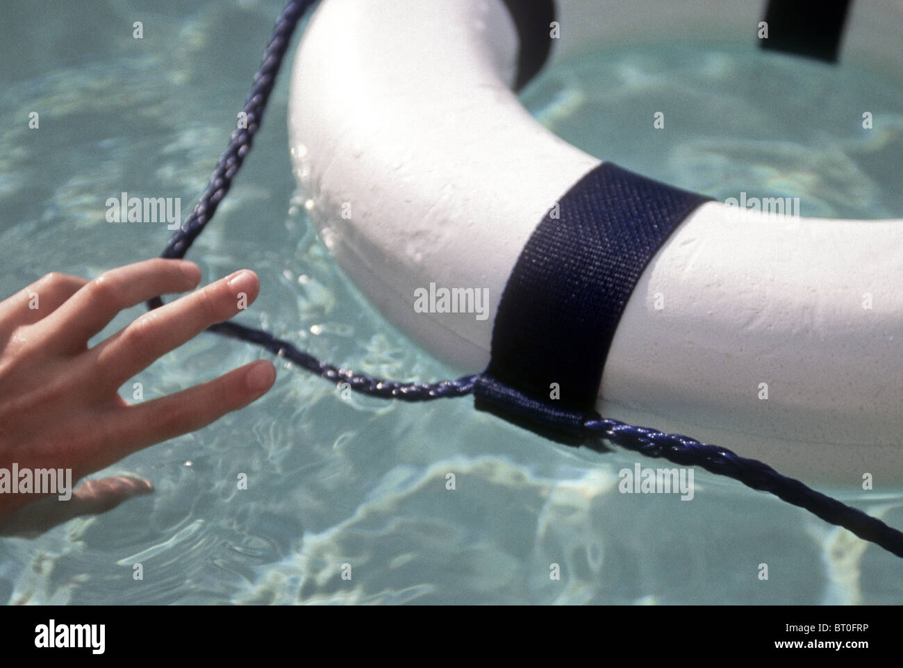 hand reaching for life preserver Stock Photo - Alamy
