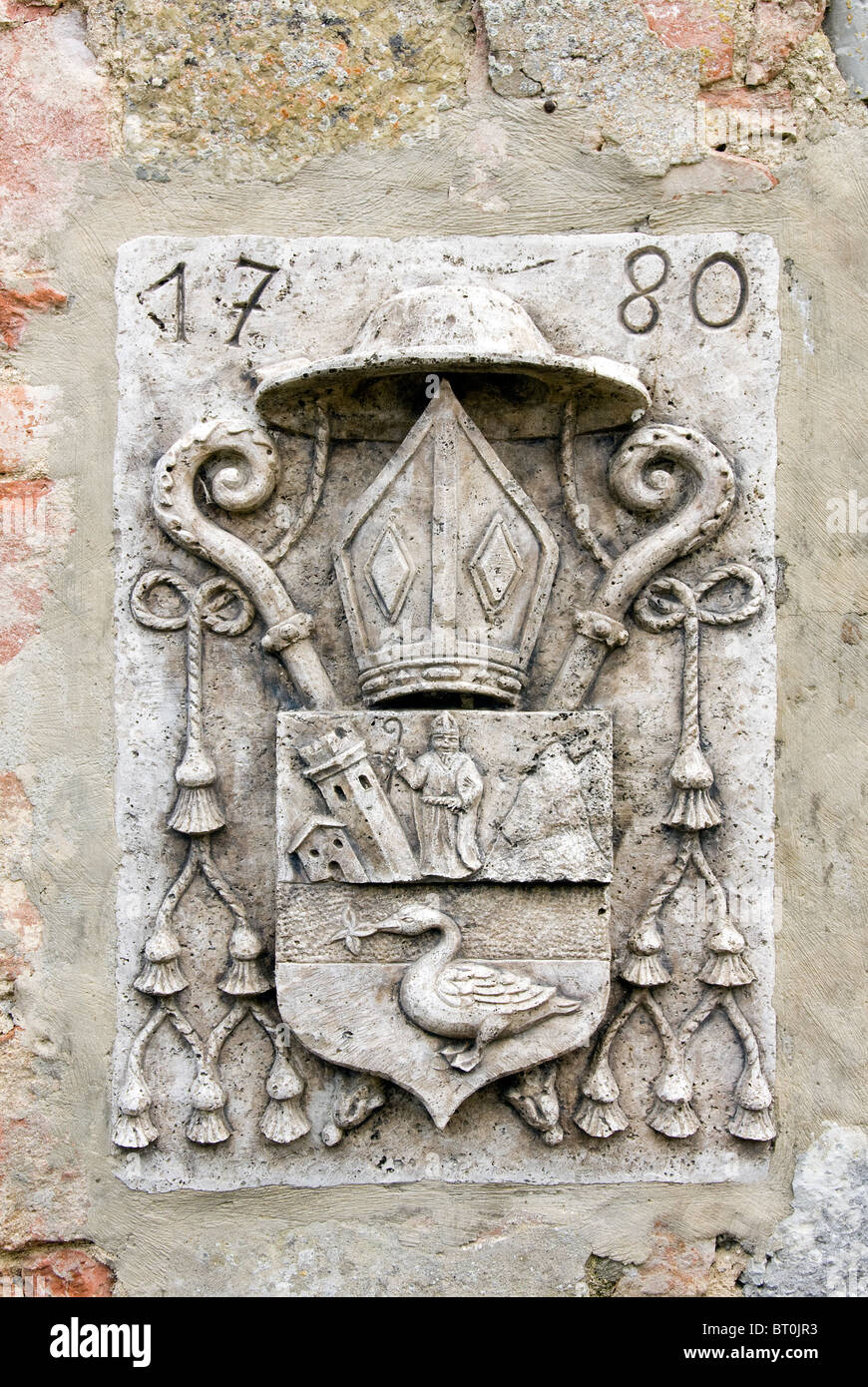Papal sign in the wall of Canonica a Cerreto Stock Photo - Alamy