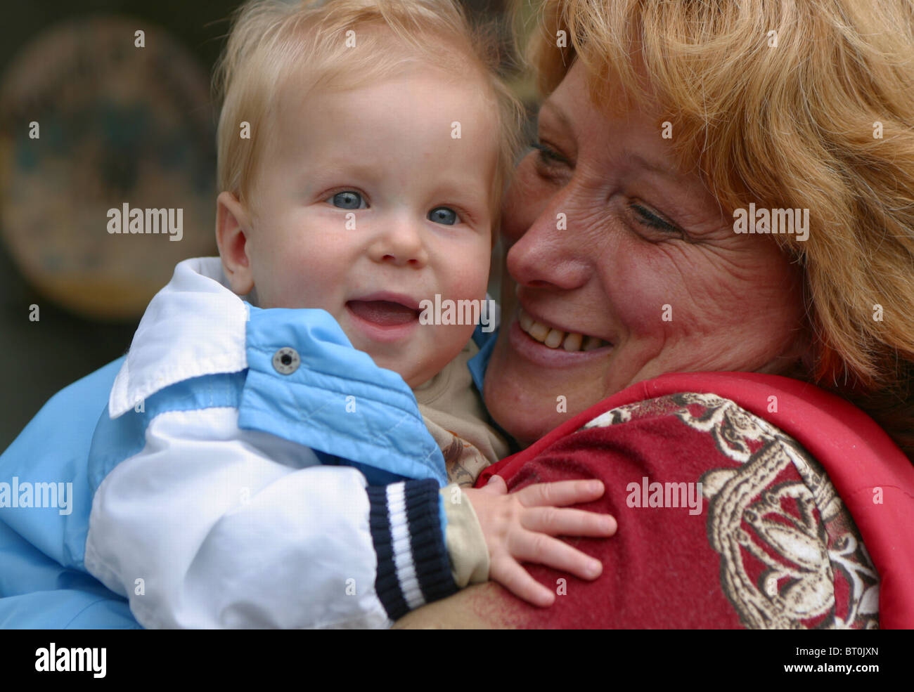 Grandmother cuddling baby boy hi-res stock photography and images - Alamy
