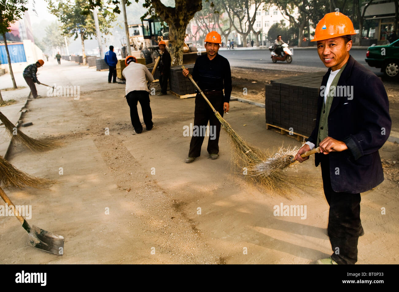Chinese construction workers are busy building a new modern China Stock ...