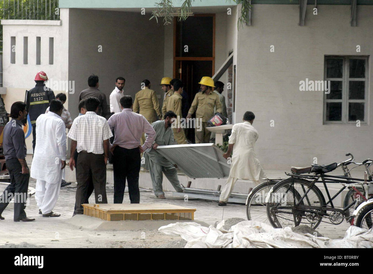People gather after gas-cylinder blast in canteen at Shaheen Complex ...