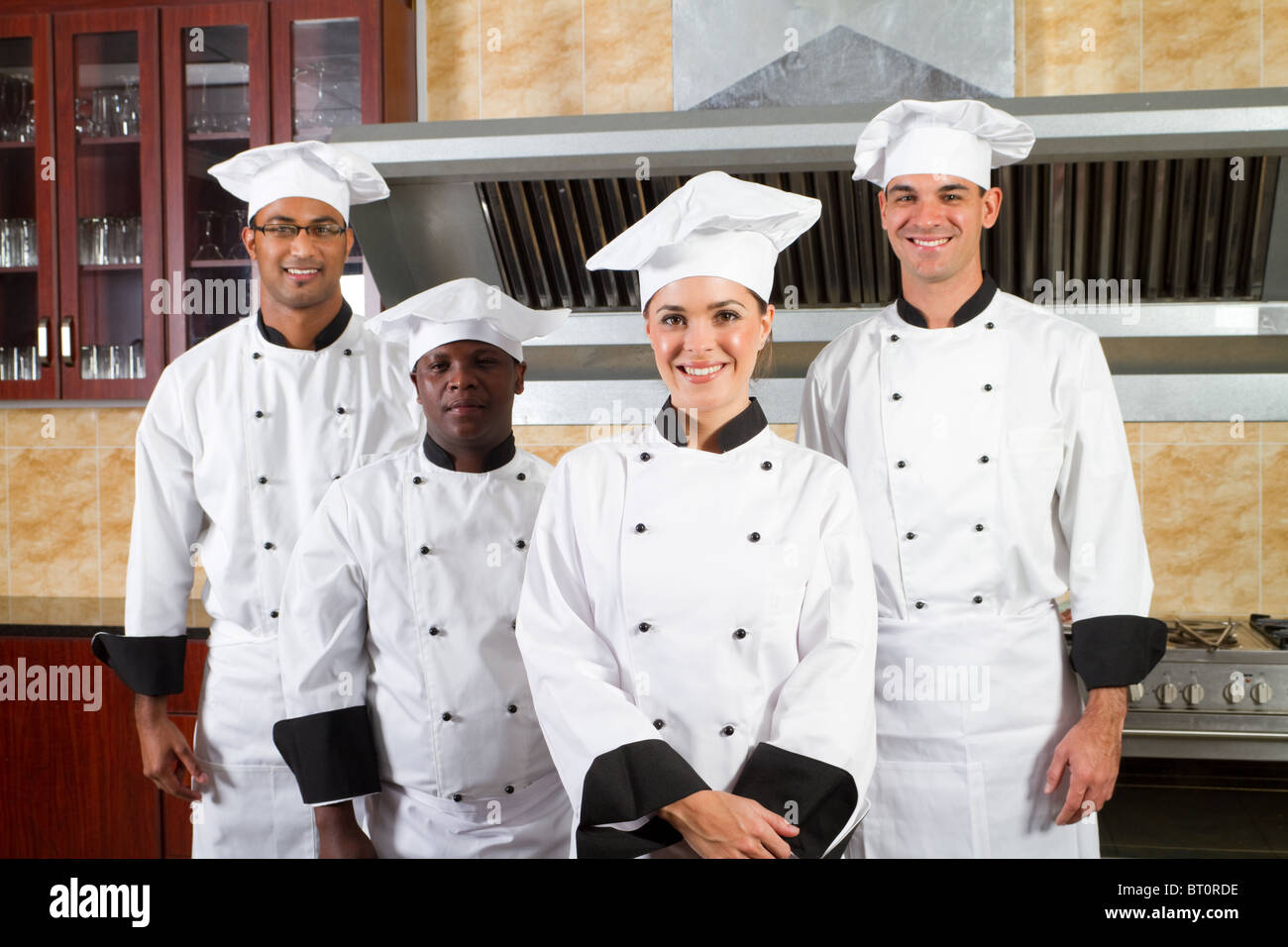 group of professional chefs in hotel kitchen Stock Photo - Alamy