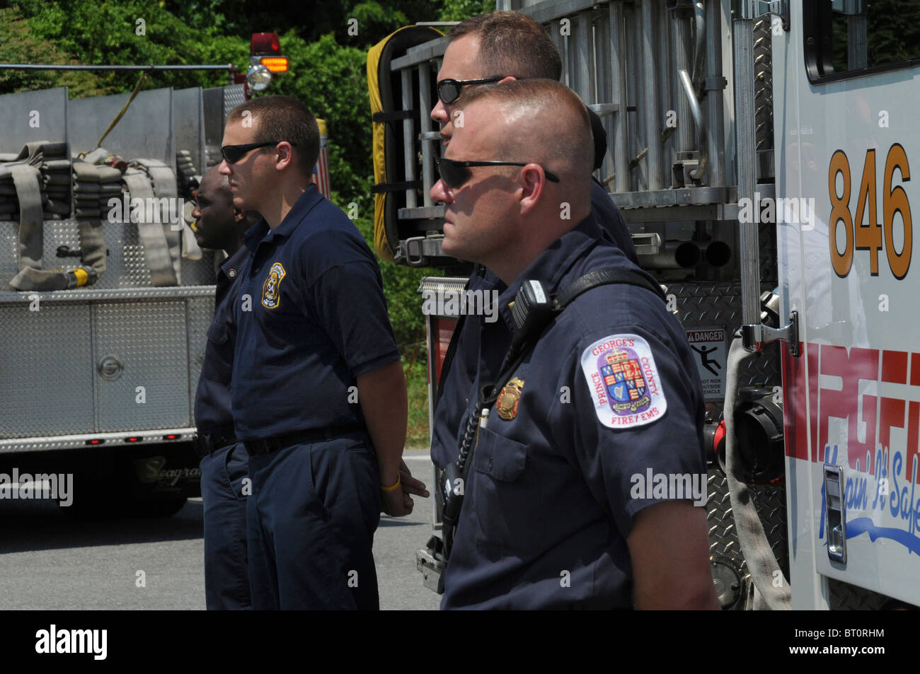 Prince George's County Firefighters stand at attention as a police ...