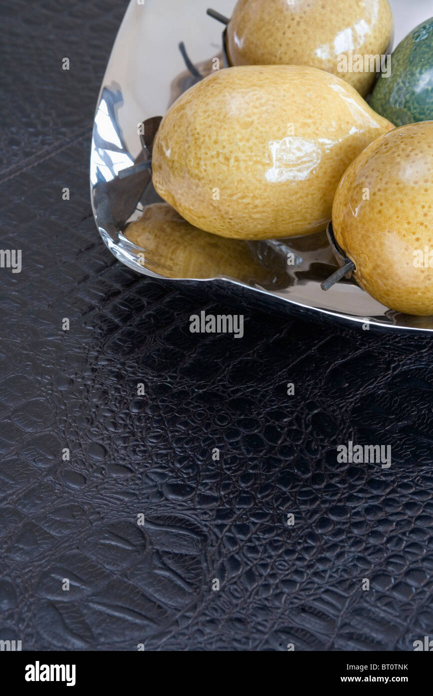Close-up of ceramic lemons in metal dish Stock Photo - Alamy