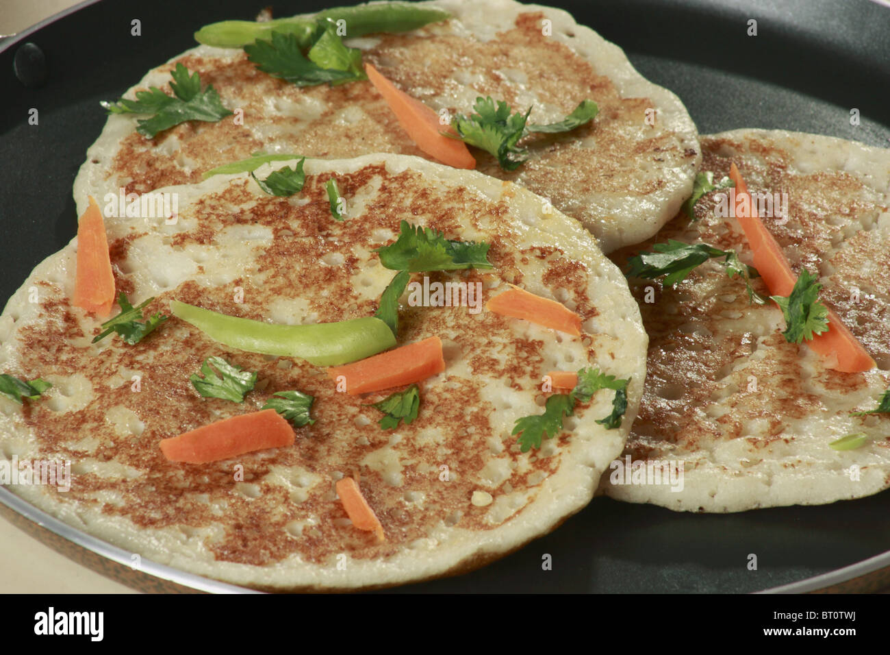 Set Dosa is a set of 3 dosas topped with butter or ghee and served with ...