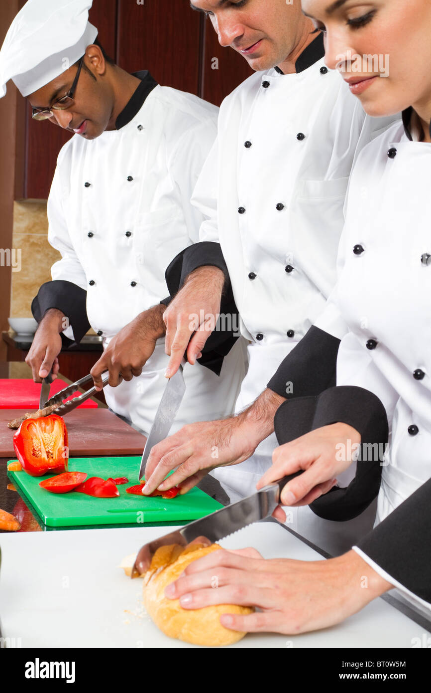 group of professional chefs cooking in industrial kitchen Stock Photo ...