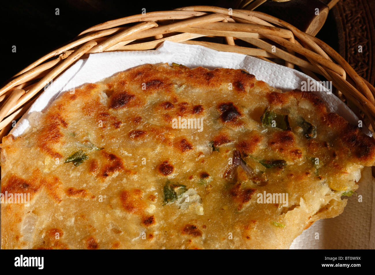 Koki is a typical Sindhi flat bread made by using wheat flour Stock ...