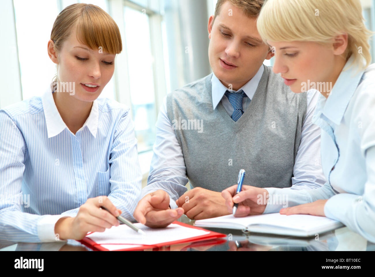 Image of business people consulting during paperwork Stock Photo - Alamy