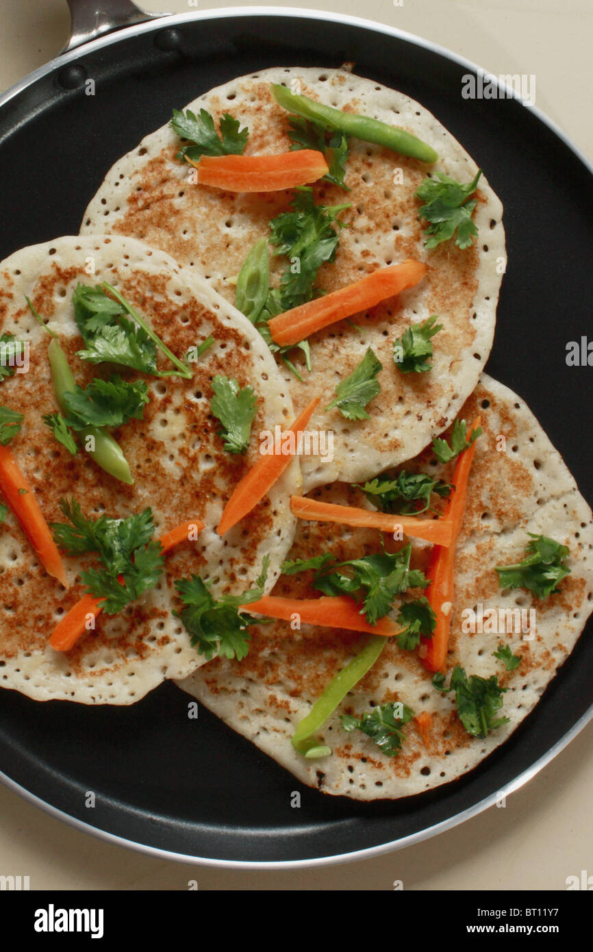 Set Dosa is a set of 3 dosas topped with butter or ghee and served with ...