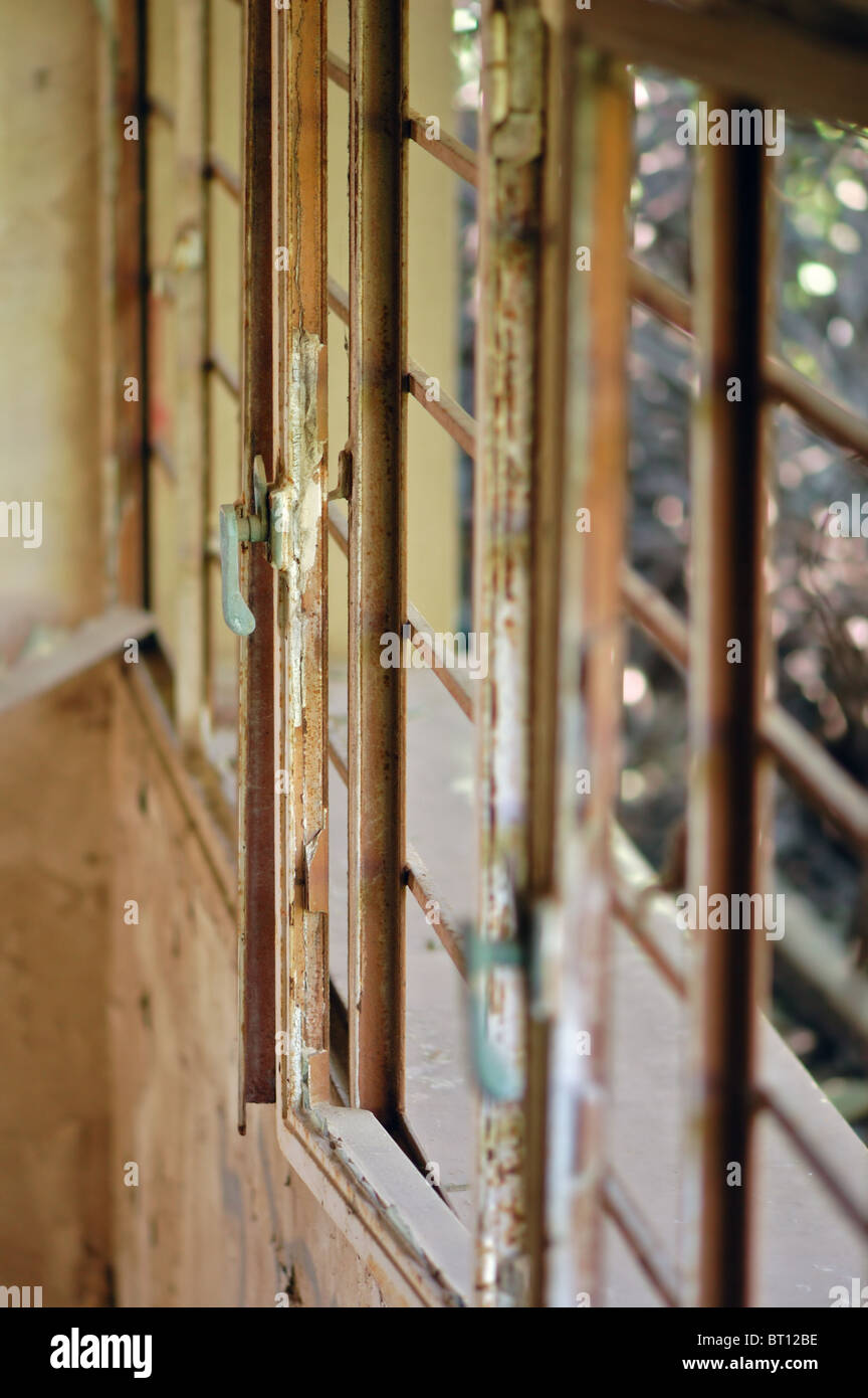 Rusty window frame in decaying house. Selective focus Stock Photo - Alamy