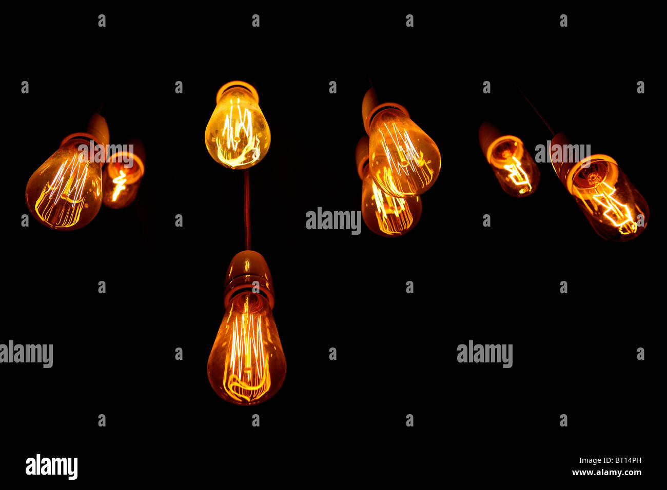 Light bulbs dangling from above Stock Photo - Alamy