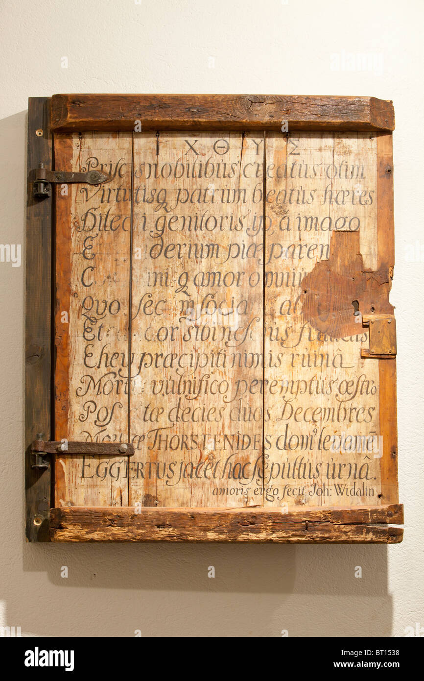 A 300 year old epitaph written in latin on a piece of panelling taken ...
