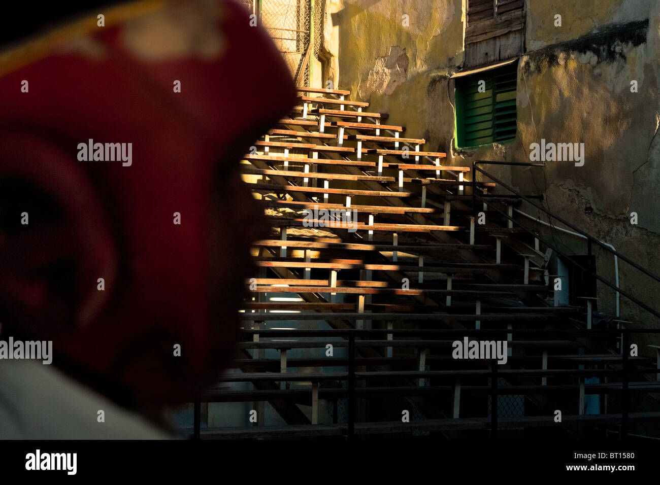 A young Cuban boxer wearing a headgear during a training session at ...