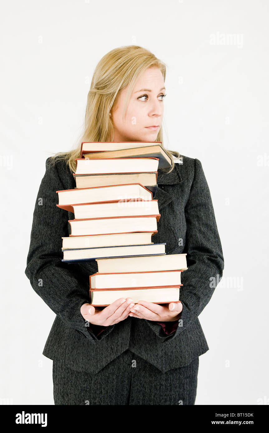 Businesswoman pile books reading hi-res stock photography and images ...