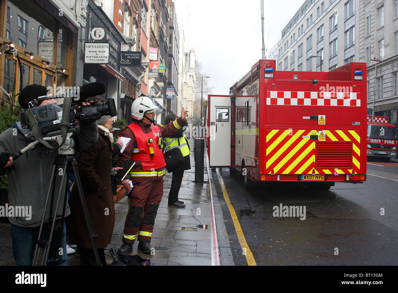 LFB press officer briefing media at the scene of a fire in London Stock ...