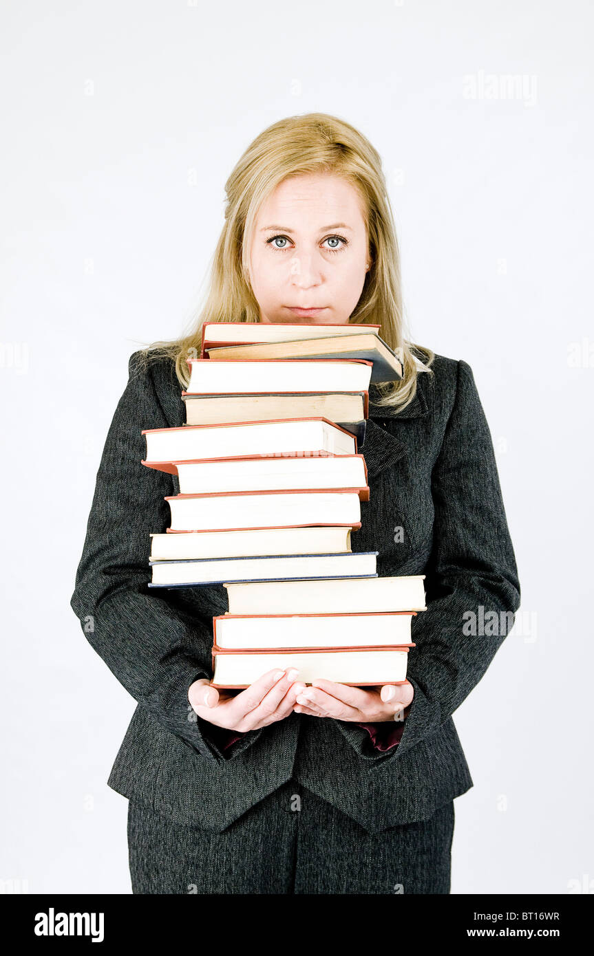 Overwhelmed woman with books hi-res stock photography and images - Alamy