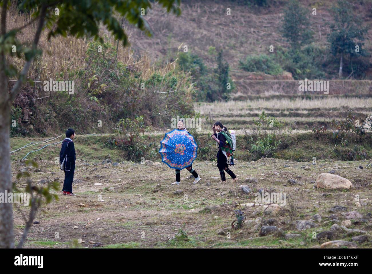 a courtship umbrella dance, Black hmong minority couple Stock Photo - Alamy