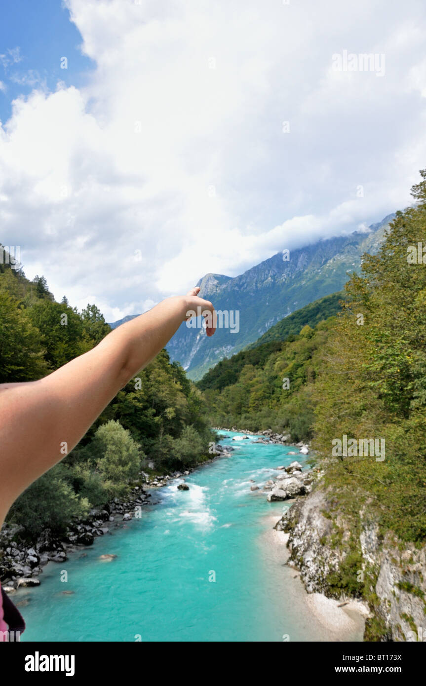 Woman pointing at mountain peak, Triglav National Park, Julian Alps, Slovenia, September 2010 ...