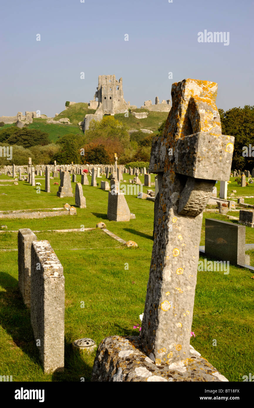 corfe castle with village graveyard in foreground dorset england uk ...