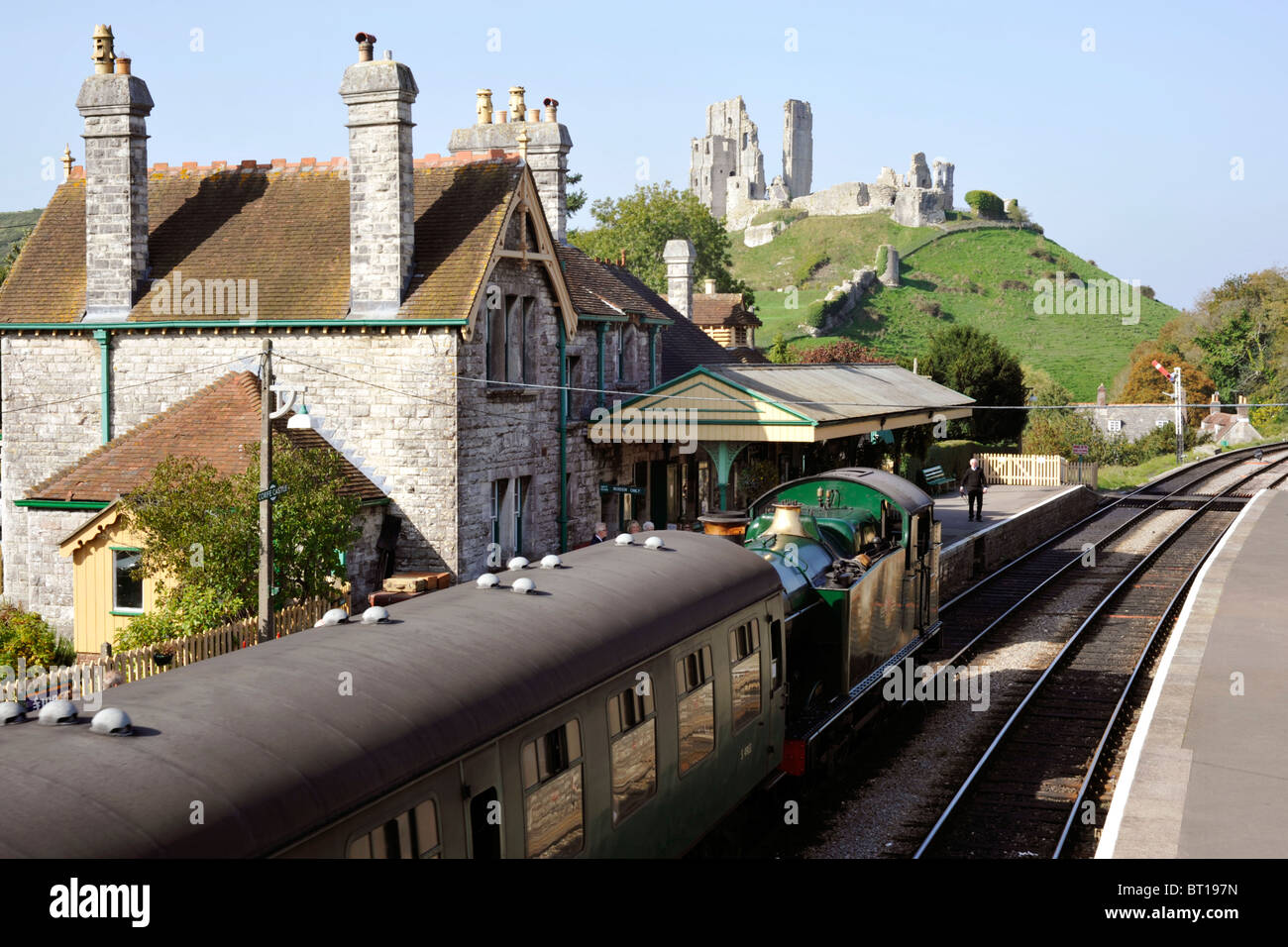 steam train at corfe station castle behind on the preserved swanage ...