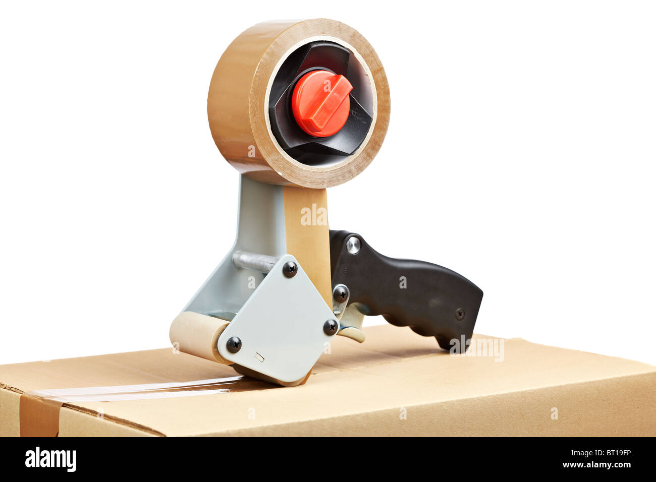 Packaging tape dispenser and shipping box isolated on white background ...