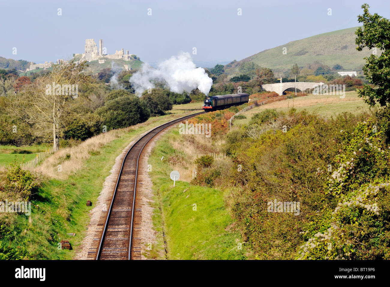 steam train corfe castle in background on the preserved swanage railway ...
