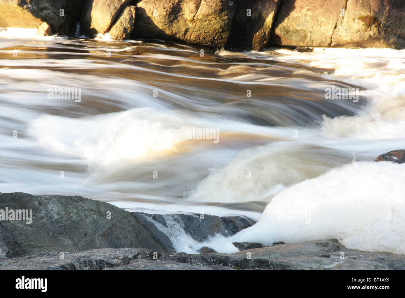 River flowing stained with foam Stock Photo - Alamy