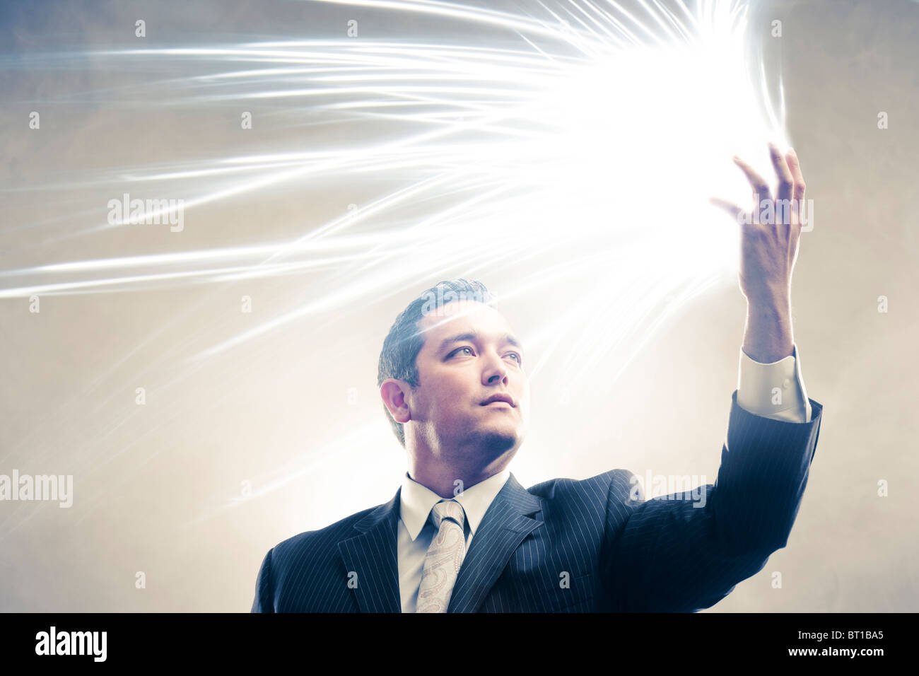 Composite image of serious asian businessman pointing Stock Photo - Alamy