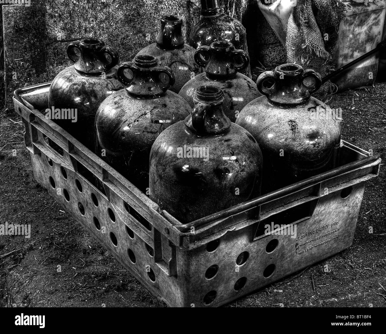Dusty old demijohn collection Stock Photo - Alamy