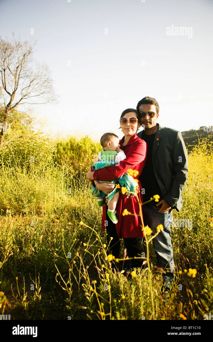 Family standing together in field Stock Photo - Alamy
