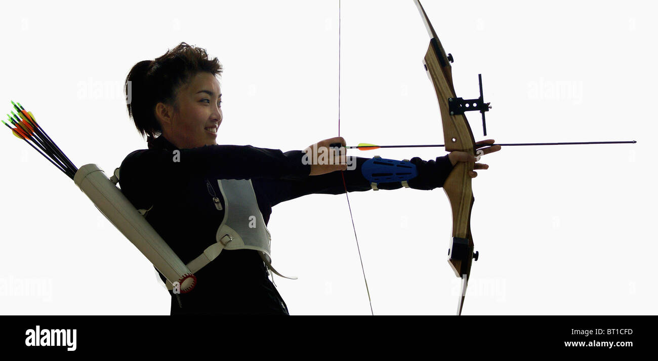 Woman in archery Stock Photo - Alamy