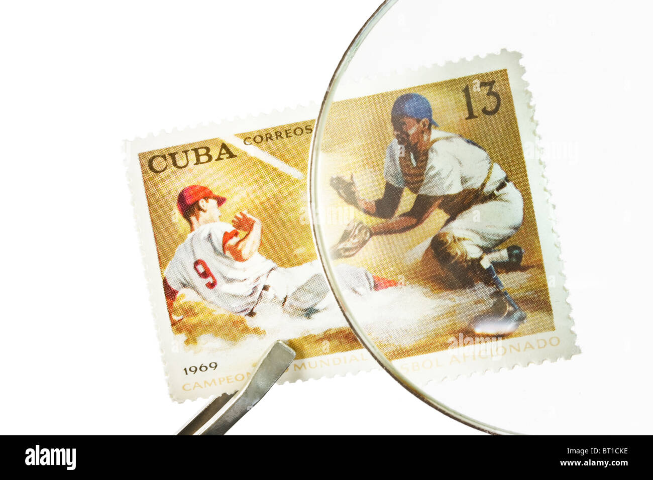 Postage stamp under magnifiying glass with tweezers Stock Photo - Alamy
