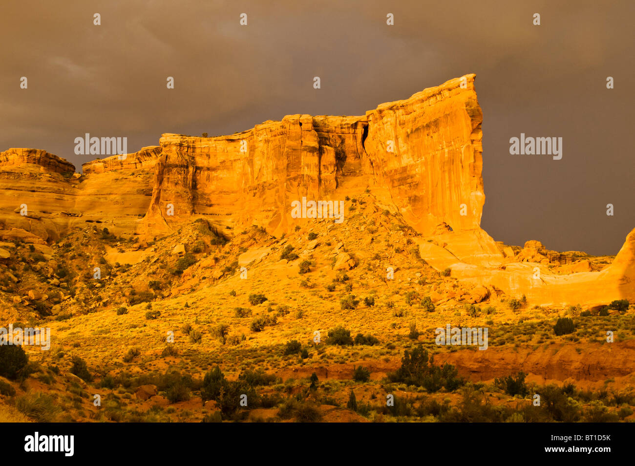The Tower of Babel glows in early morning light as rainstorm clouds ...