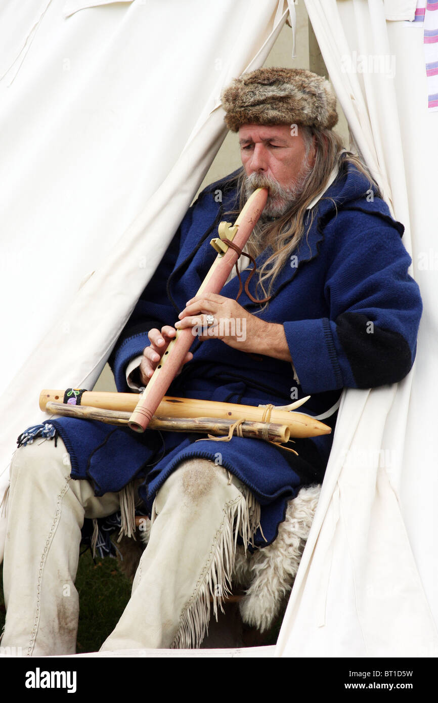An old west character playing his flute from his tent Stock Photo - Alamy