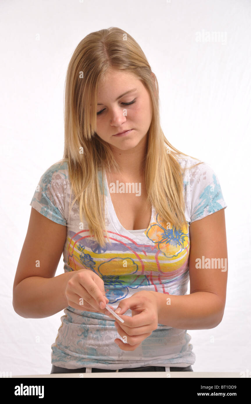 Young girl filing her nails Stock Photo - Alamy