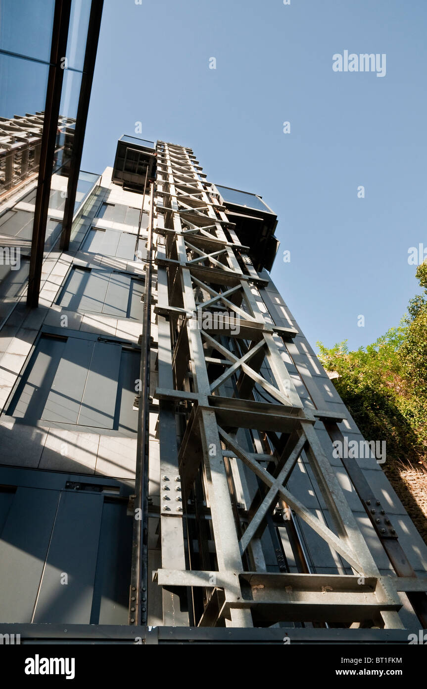 Big city lifts on the side of a building Stock Photo - Alamy