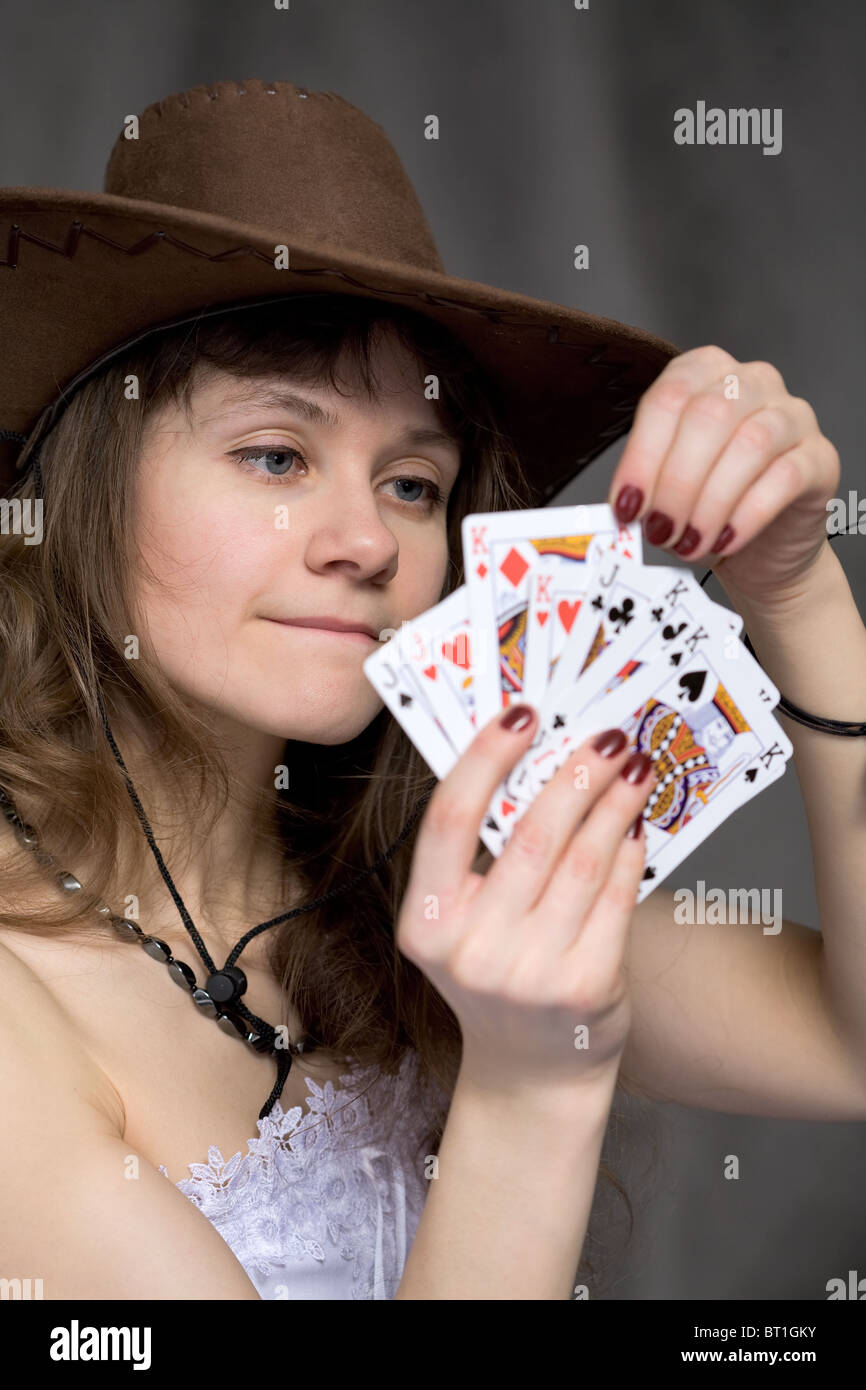 Portrait girl with a playing-cards in hand on black Stock Photo - Alamy
