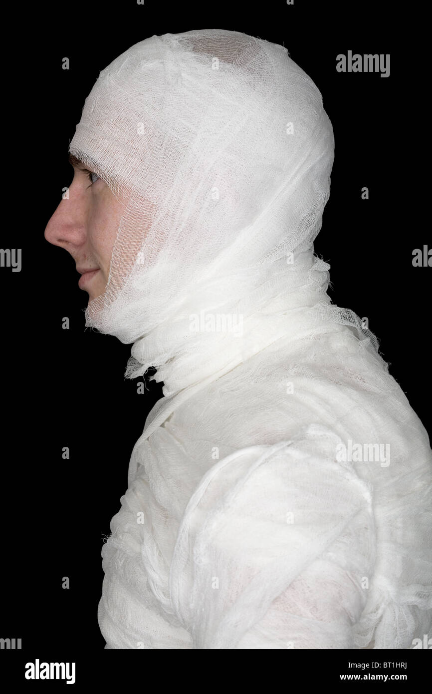 Man in bandage on the black background Stock Photo - Alamy