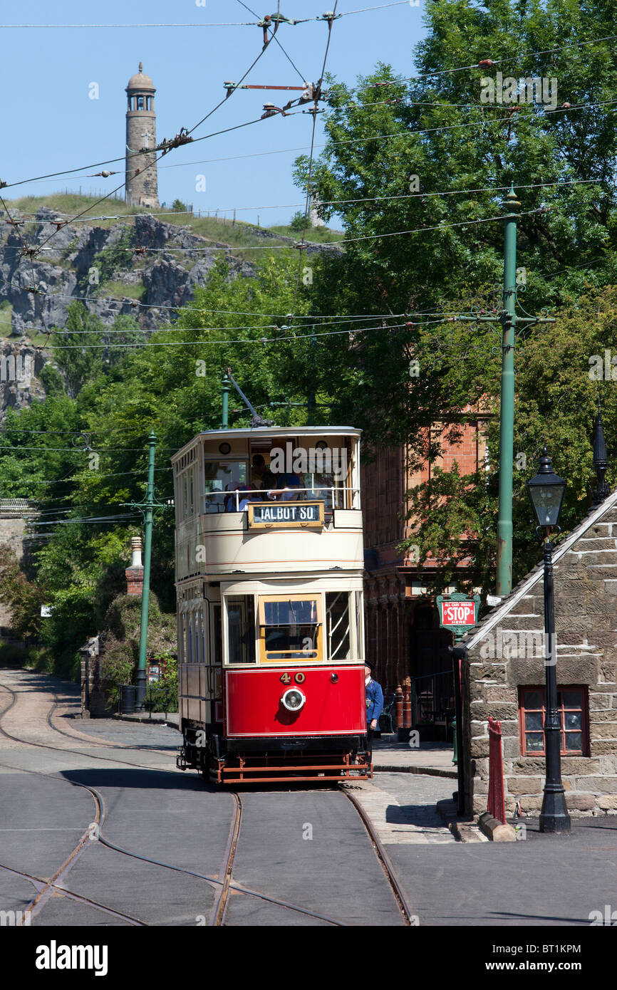 Tourists board a tram in front of the old Derby Assembly Rooms building ...