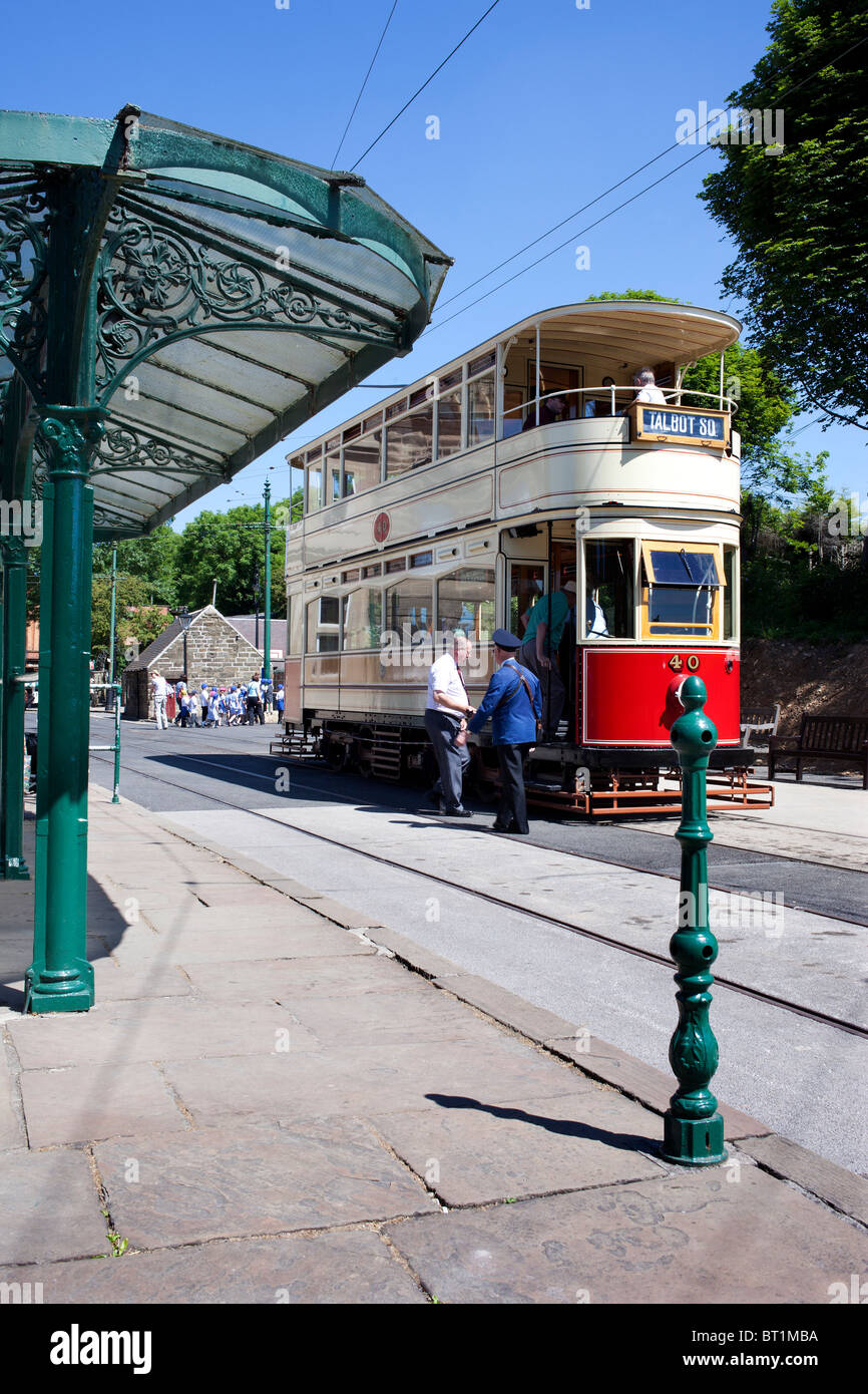 Tourists board a tram in front of the old Derby Assembly Rooms building ...