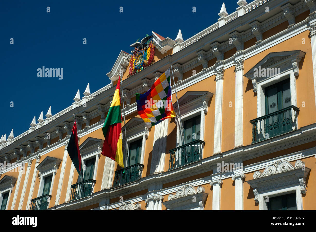 The Bolivian flag and Andean flag flies outside the Presidents Building ...