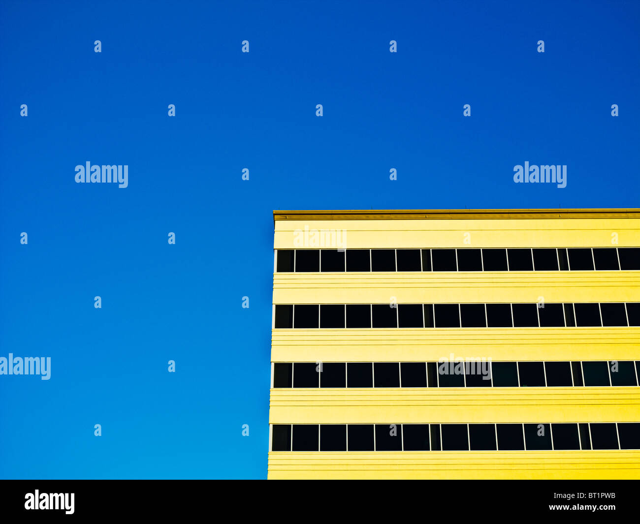 Modern building exterior against blue sky Stock Photo - Alamy