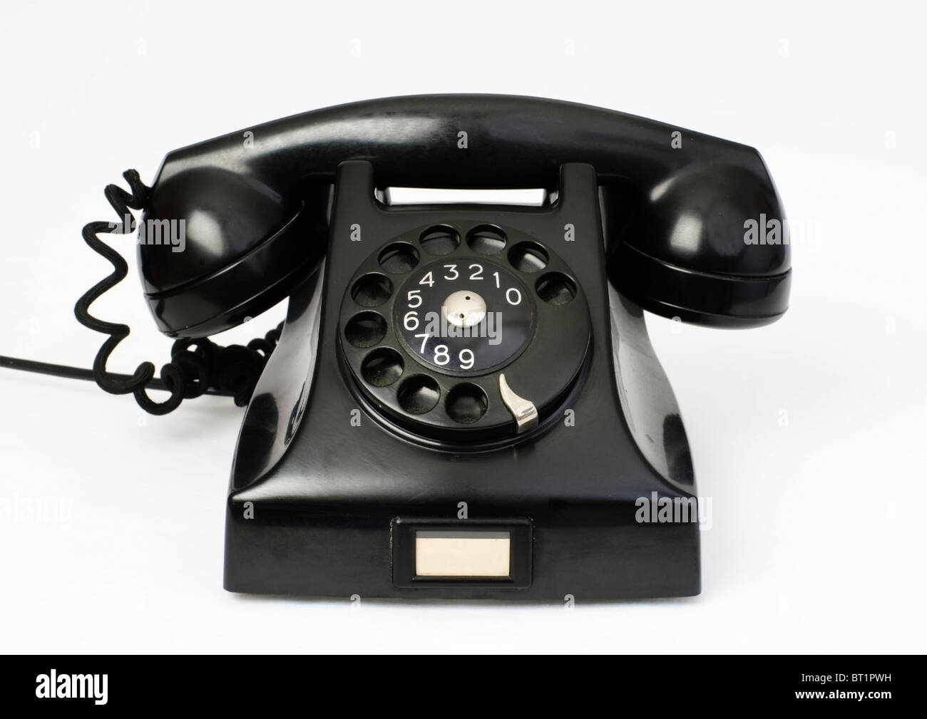 Old classic black Bakelite telephone on white background Stock Photo ...