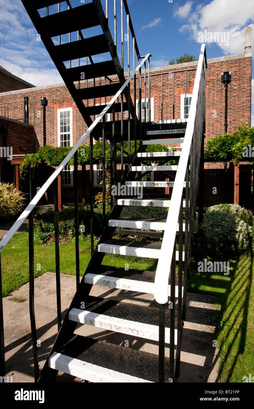A large external fire escape bridge and stairway attached to a public ...