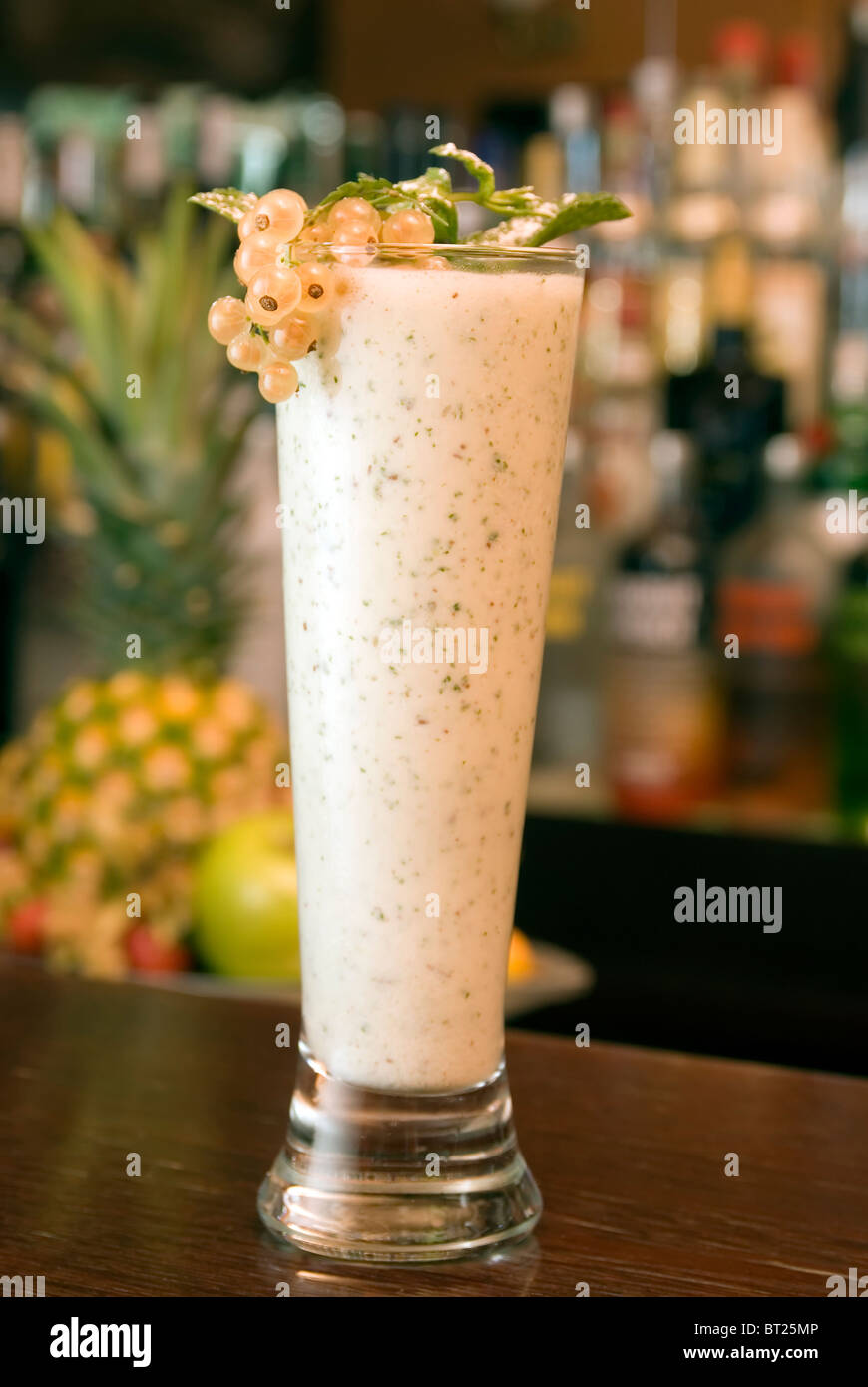 Gooseberry Cocktail with white currants in a bar setting Stock Photo ...
