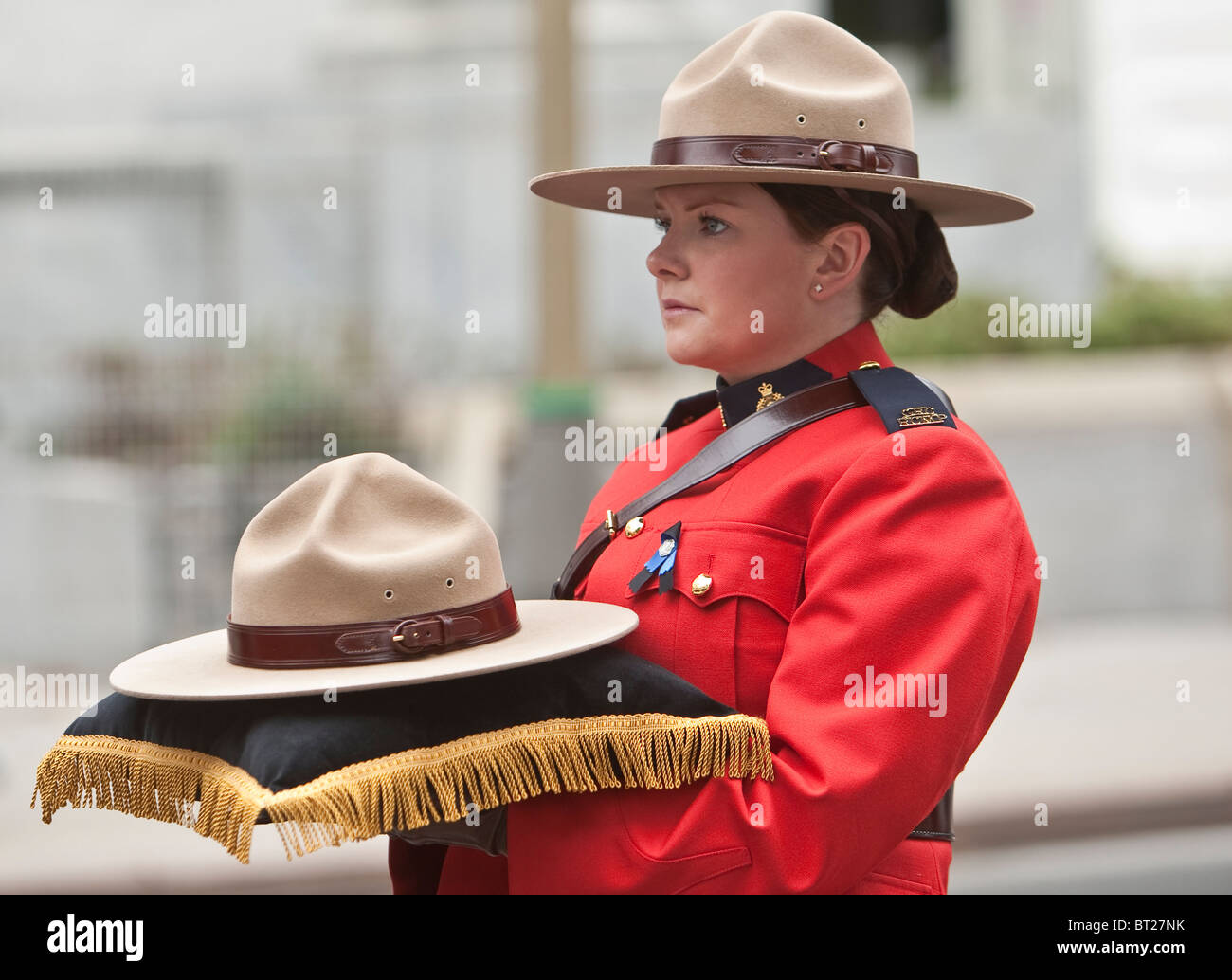 A member of the RCMP holds a hat during a parade commemorating police ...
