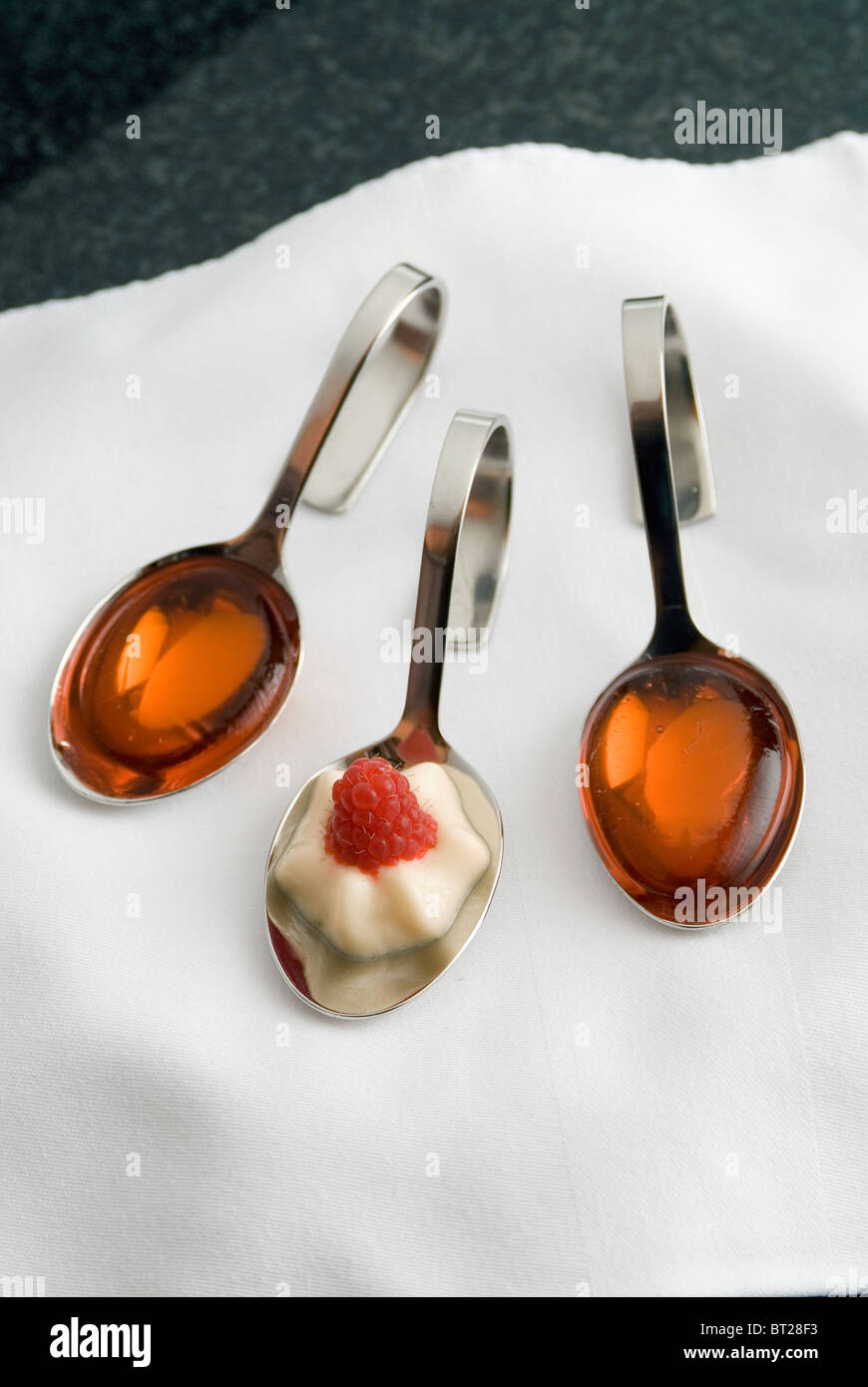 Three Spoons with honey and creme Stock Photo - Alamy