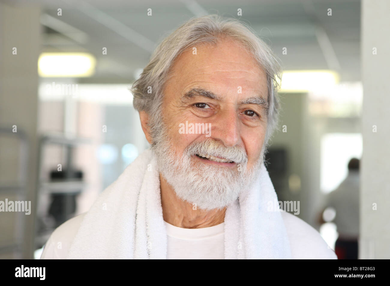 Physically fit and health conscious senior man in gym, close-up, posed ...