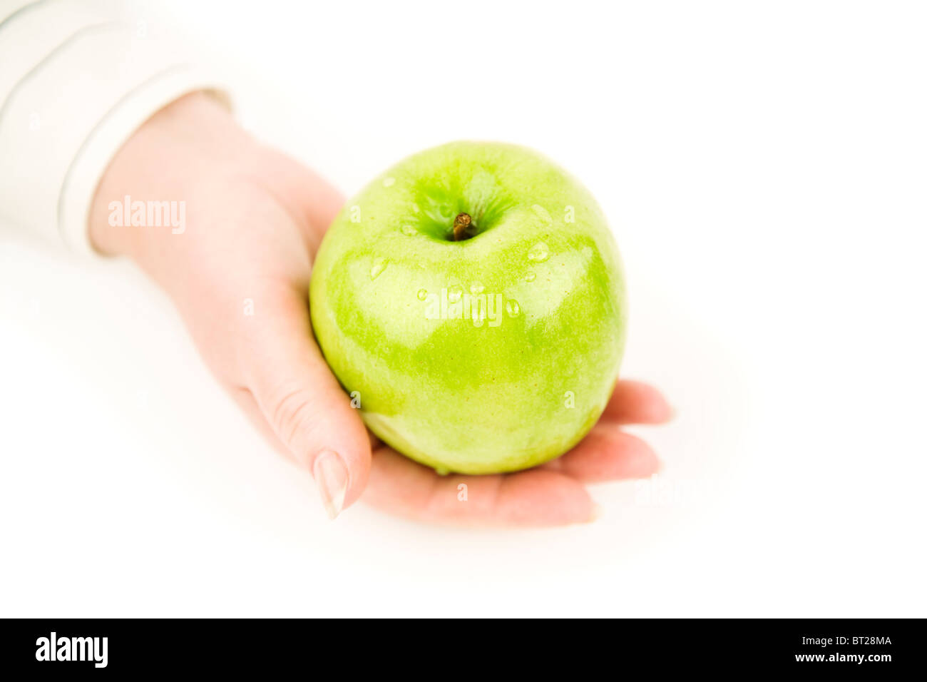 apple on hand isolated Stock Photo - Alamy
